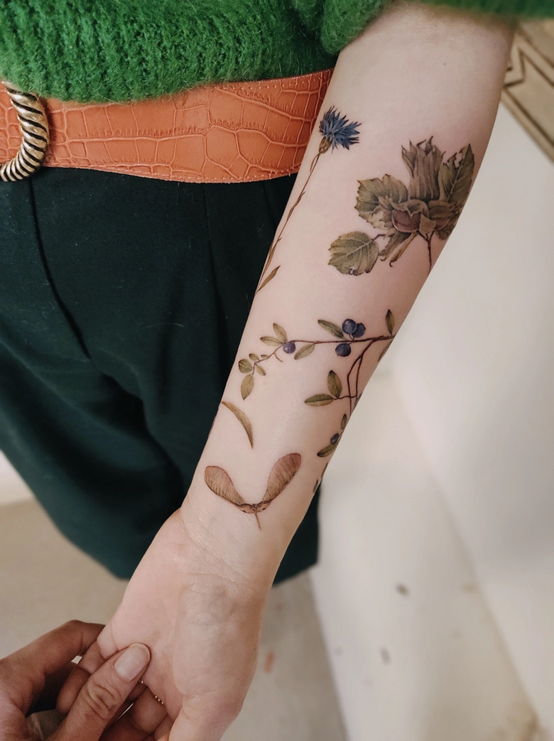 Elegant Botanical Wrap Tattoo Ideas for Arm, Forearm, and Full Body Designs