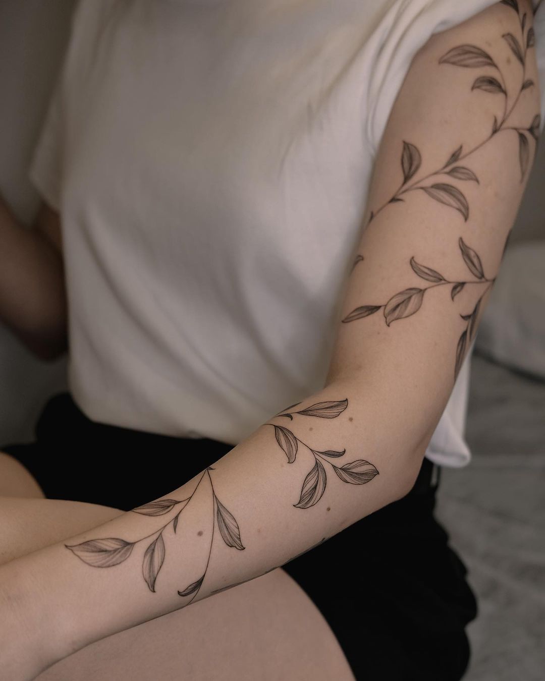 Elegant Botanical Wrap Tattoo Ideas for Arm, Forearm, and Full Body Designs