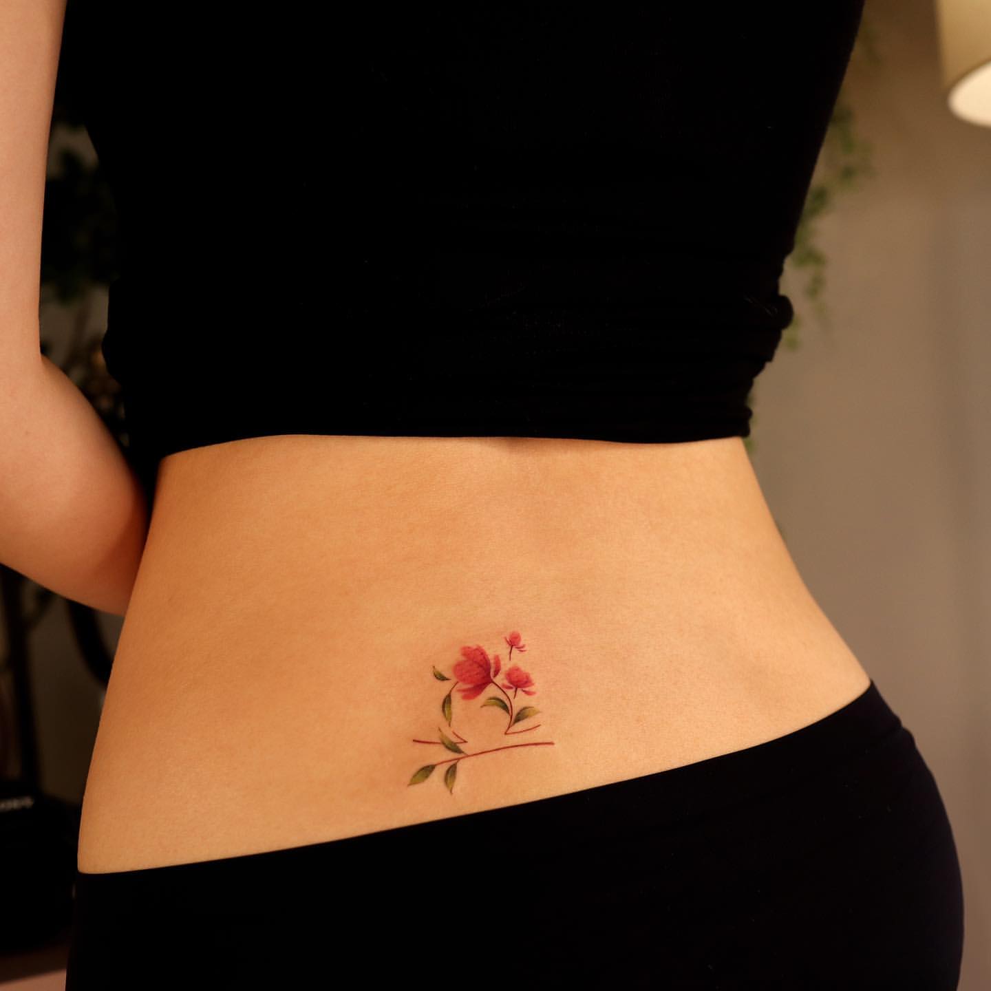 Lower back tattoo designs for women and men with meaning, flowers, and ...